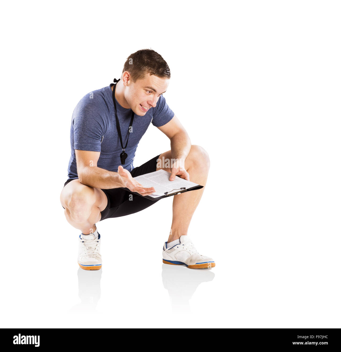 Professional fitness coach isolated on white background Stock Photo - Alamy