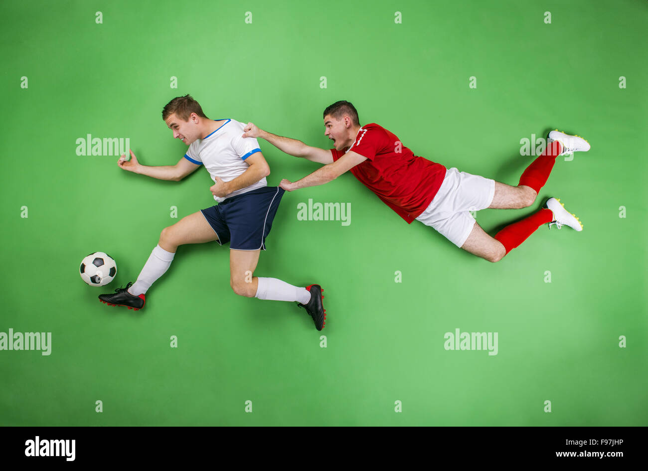 Two football players fight hi-res stock photography and images - Alamy