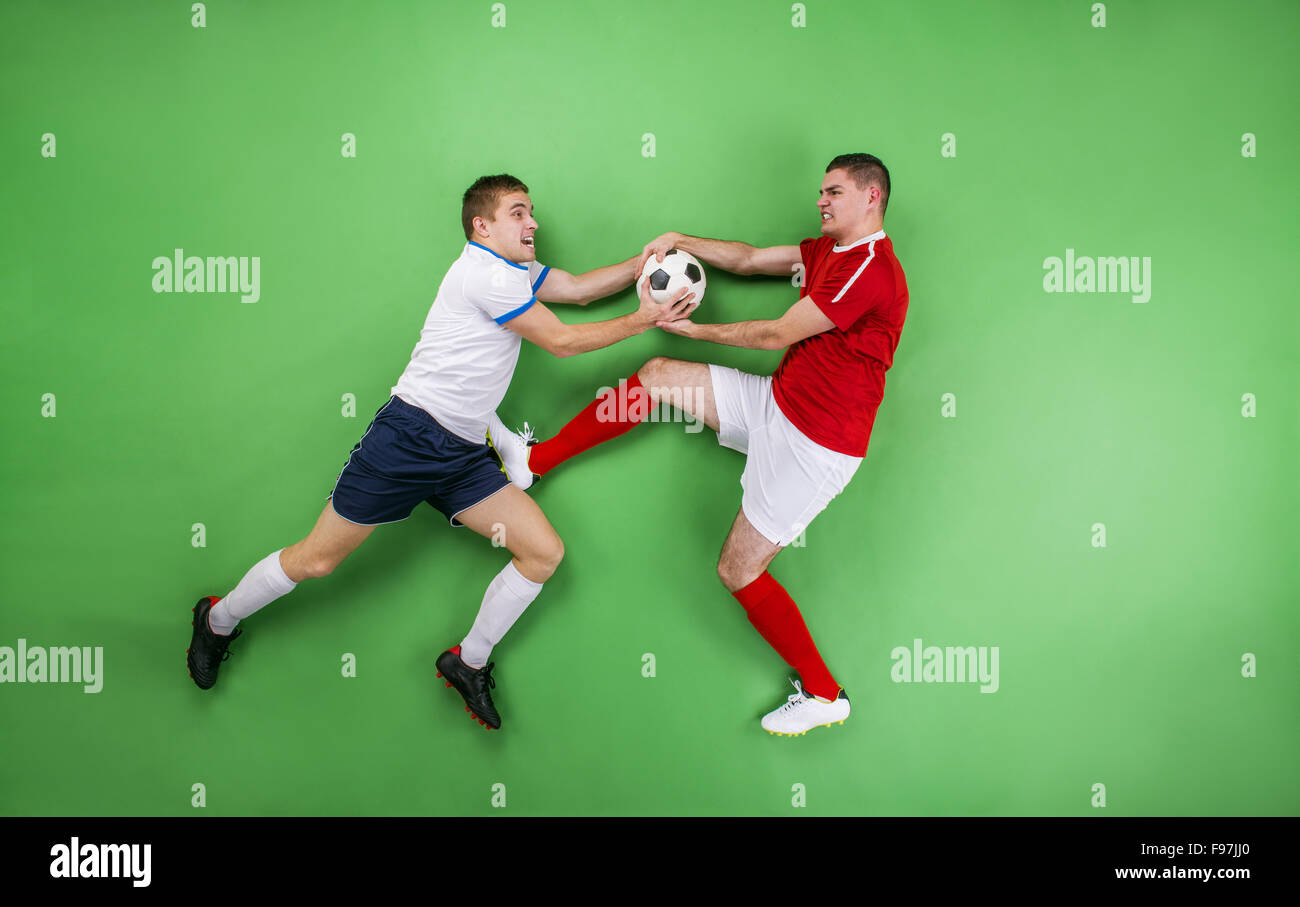 Football players fighting ball hi-res stock photography and images - Alamy