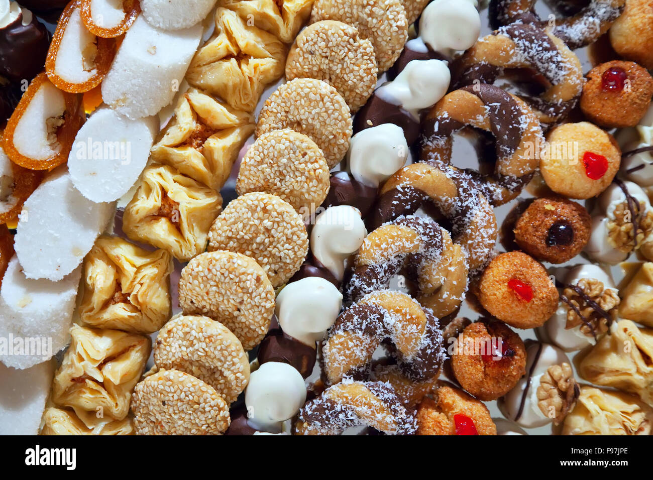 Different fancy cakes on banquet table Stock Photo - Alamy