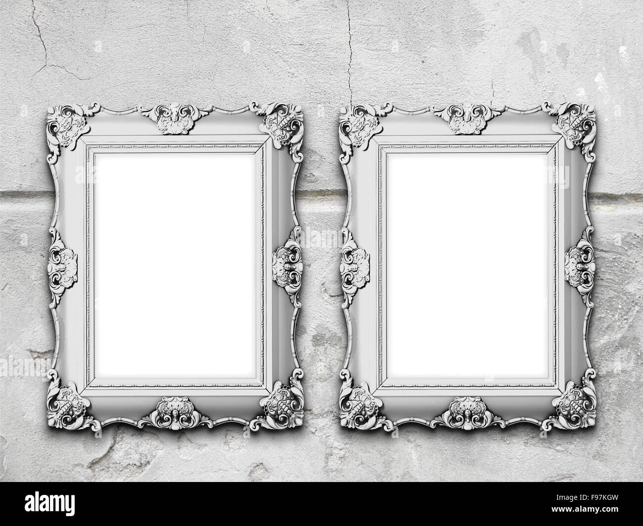 Close-up of two gray baroque frames on gray weathered concrete wall ...