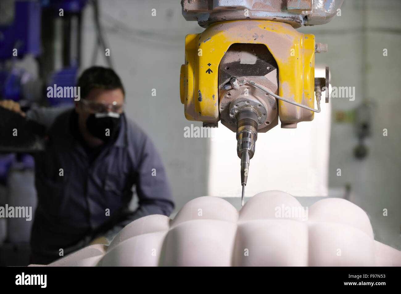 worker and multi axis machine Stock Photo - Alamy