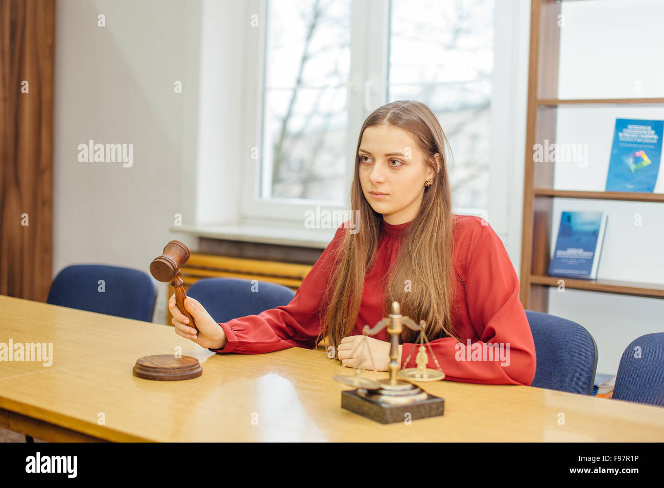 Judge in a courtroom striking the gavel and smile Stock Photo - Alamy