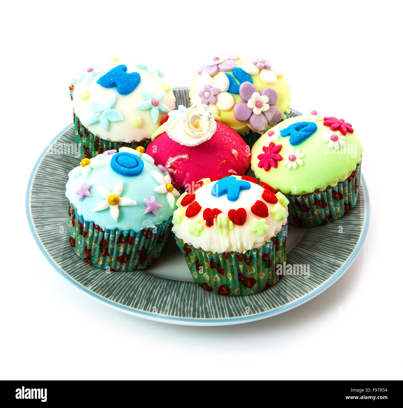 Cupcakes with spring flowers on white isolated background Stock Photo ...