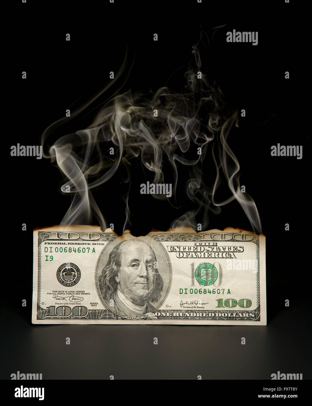 Hundred US Dollars Up In Smoke Stock Photo - Alamy