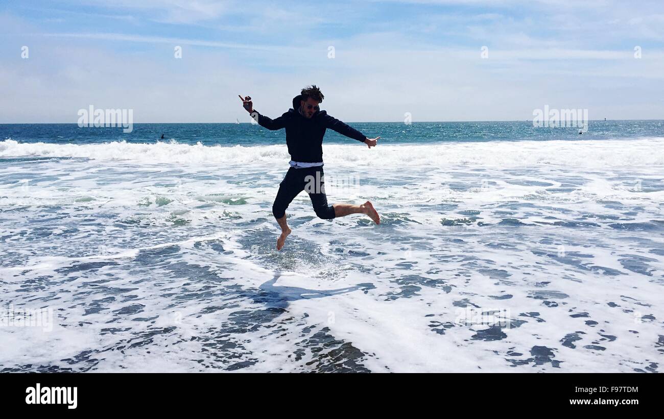 Man in waves hi-res stock photography and images - Alamy