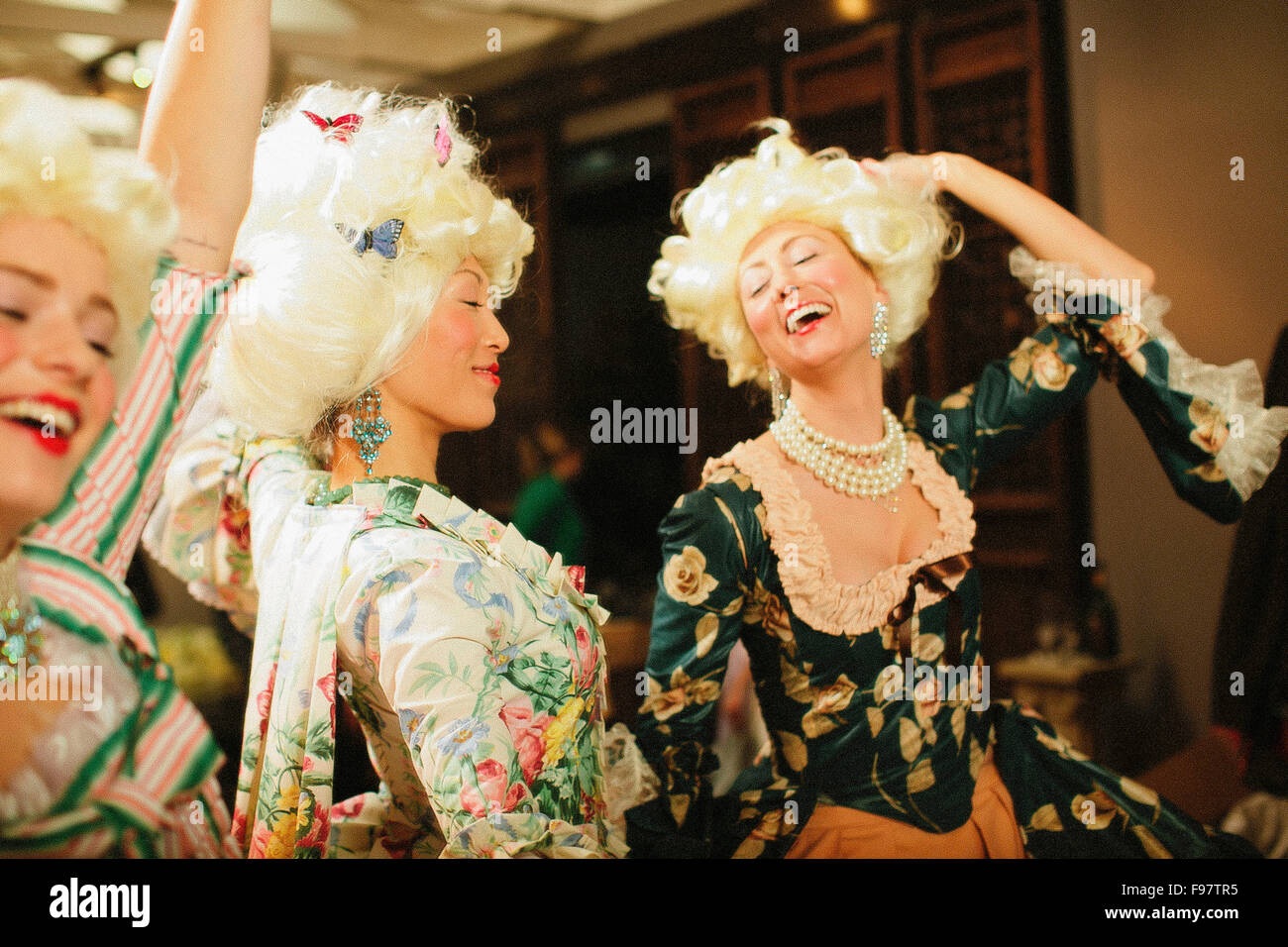 Women dancing during Victorian themed dinner Stock Photo - Alamy
