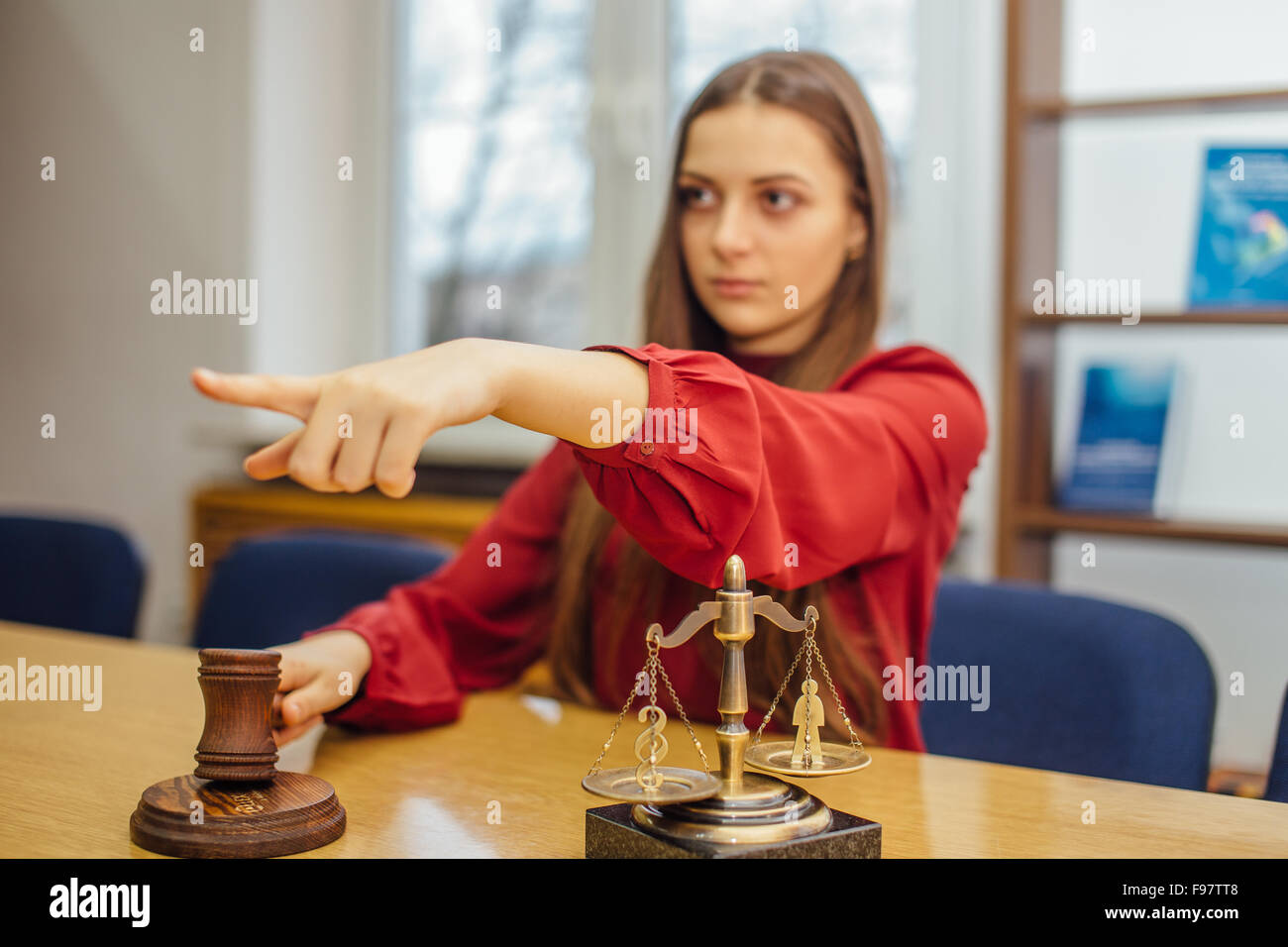 Judge in a courtroom striking the gavel and smile Stock Photo - Alamy