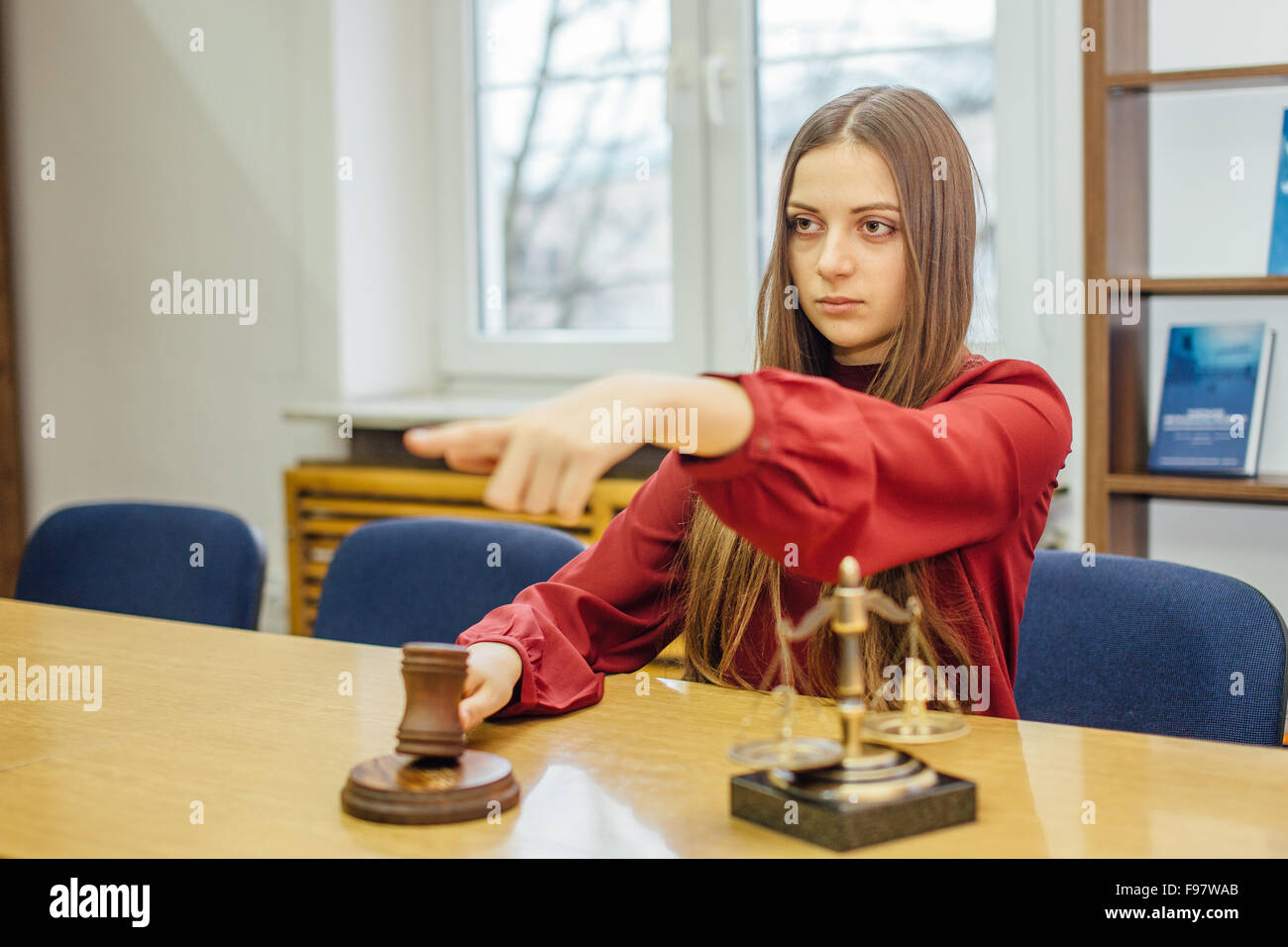 Judge in a courtroom striking the gavel and smile Stock Photo - Alamy