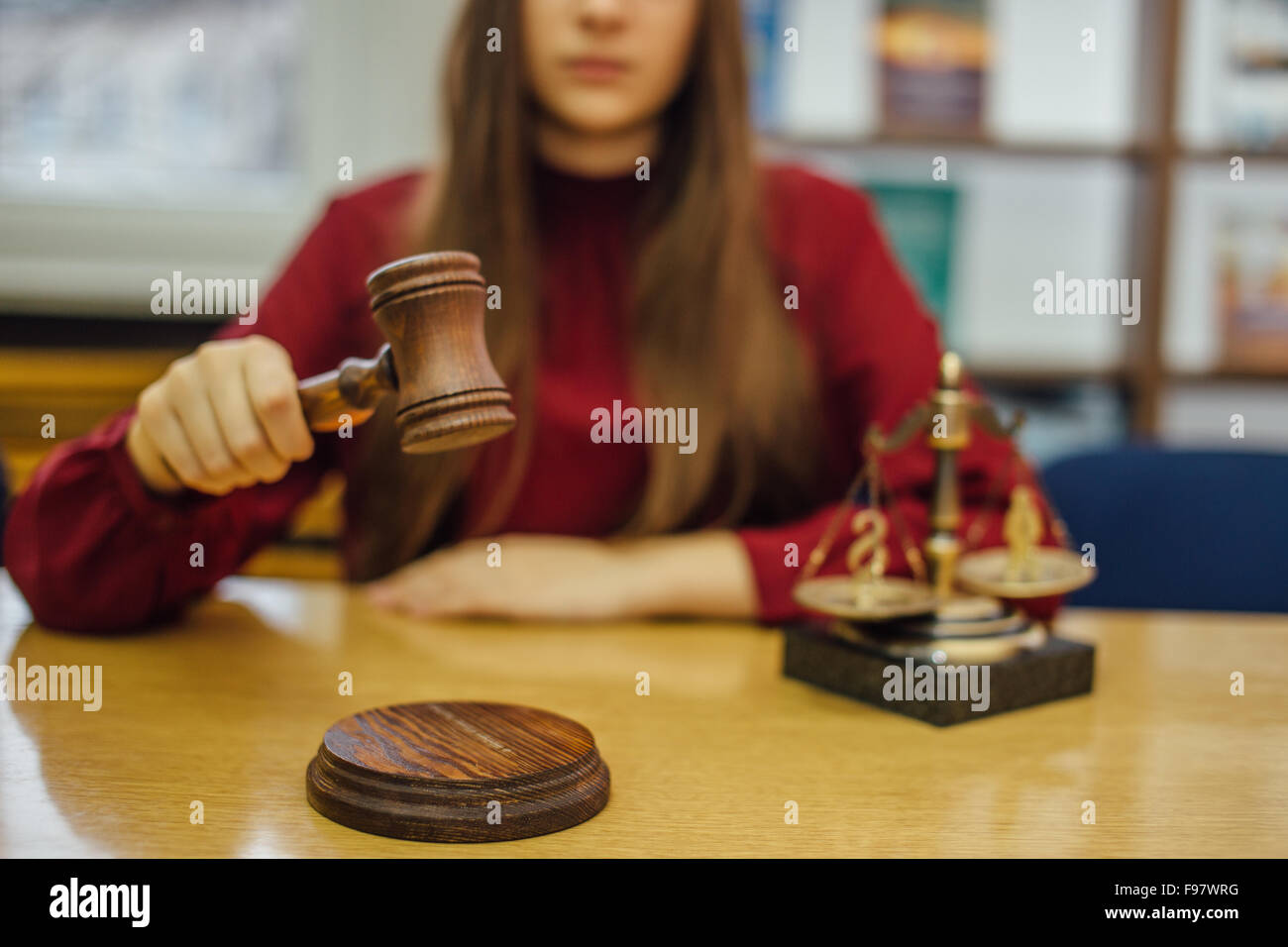 Judge in a courtroom striking the gavel and smile Stock Photo - Alamy