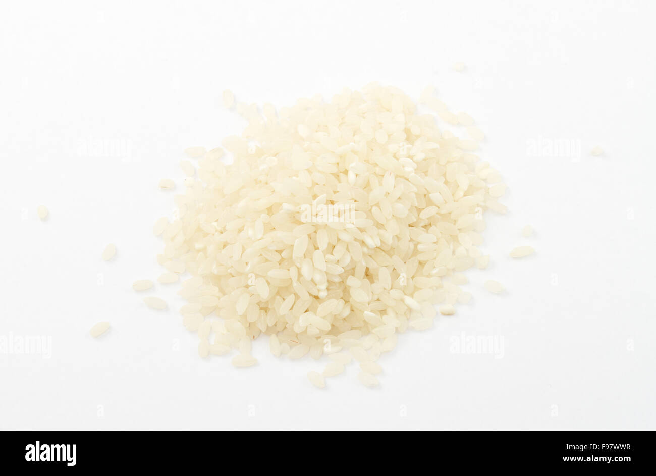 Pile of organic rice (on white Stock Photo - Alamy