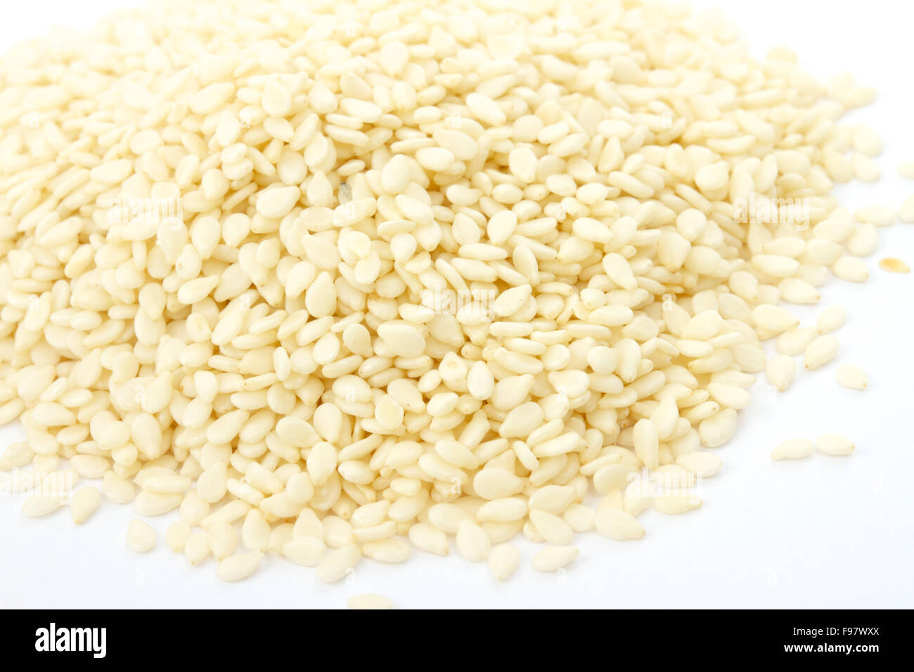 A close up on a pile of dried Sesame Seed isolated on a white ...