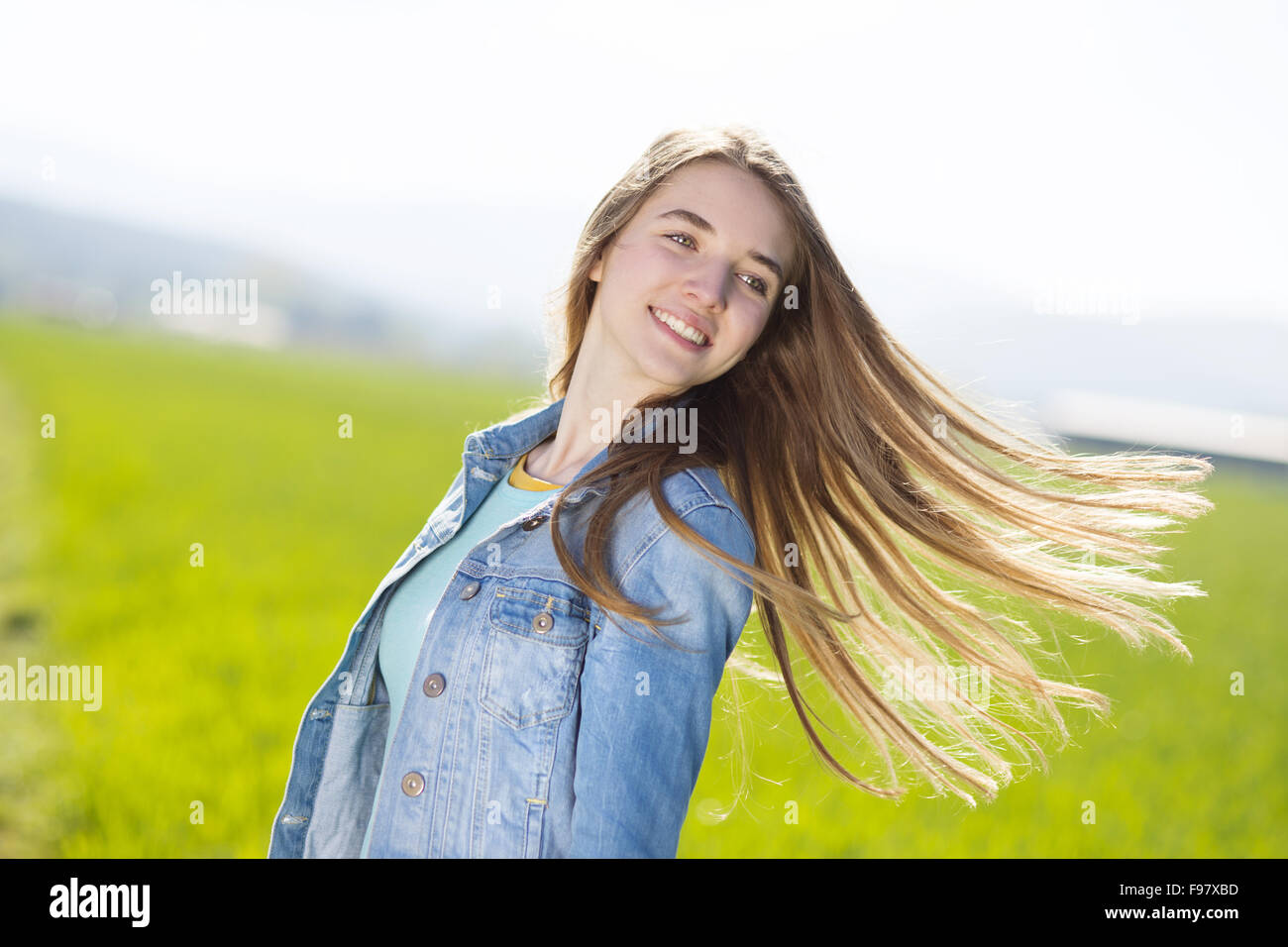 Girl in blue jeans hi-res stock photography and images - Alamy