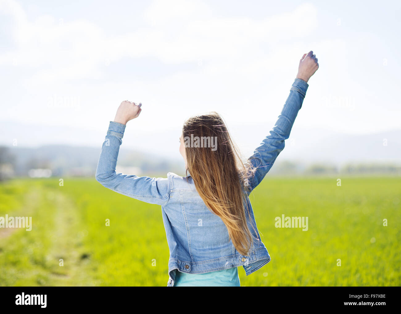 Girl in blue jeans hi-res stock photography and images - Alamy