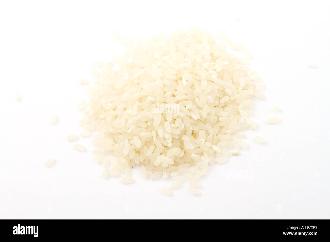 Pile of organic rice (on white Stock Photo - Alamy