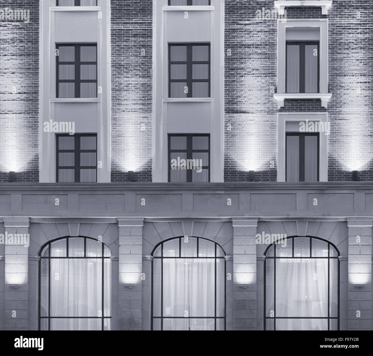 Building facade with windows and frames illuminated at night in an ...