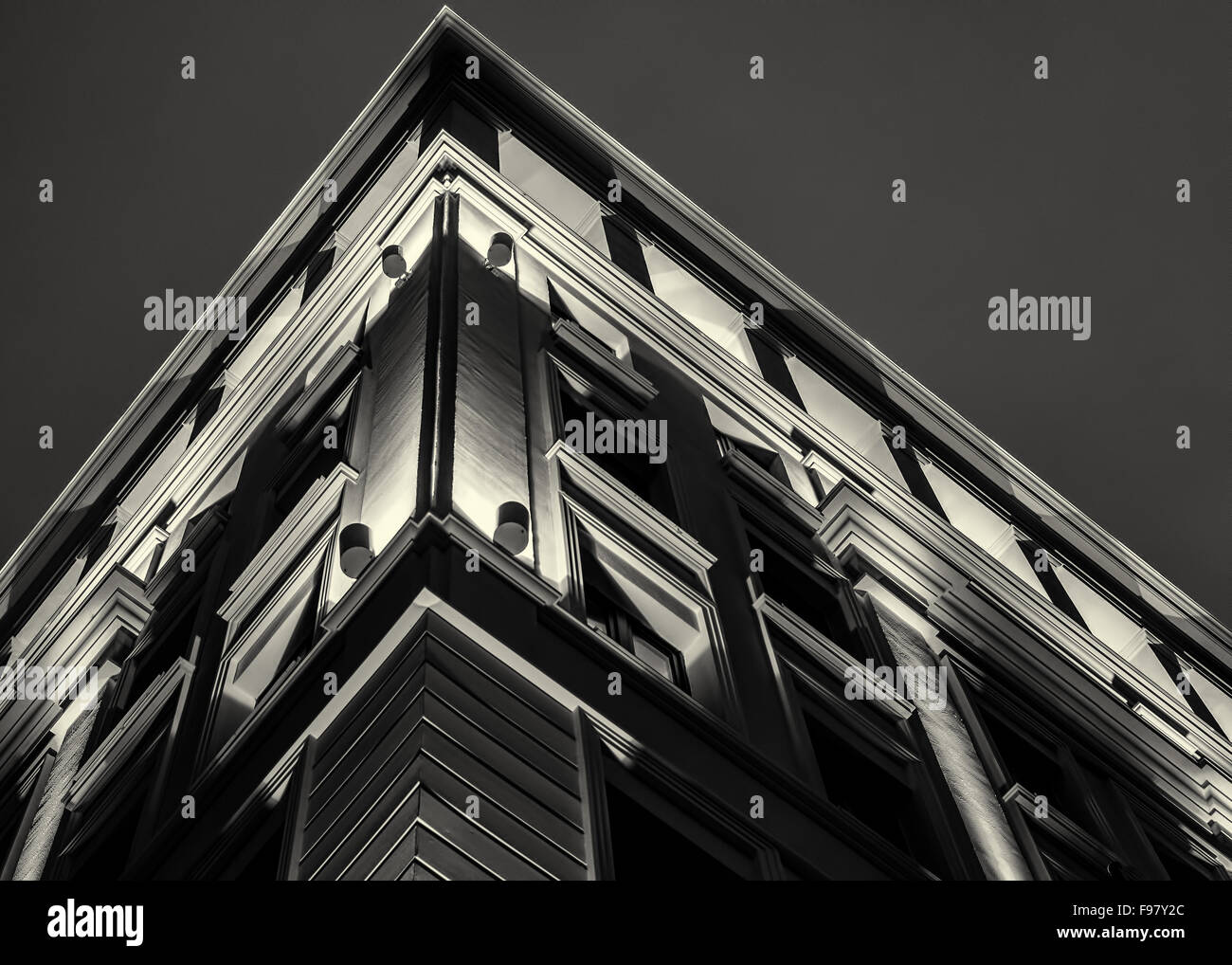 Building facade with windows and frames illuminated at night in an ...