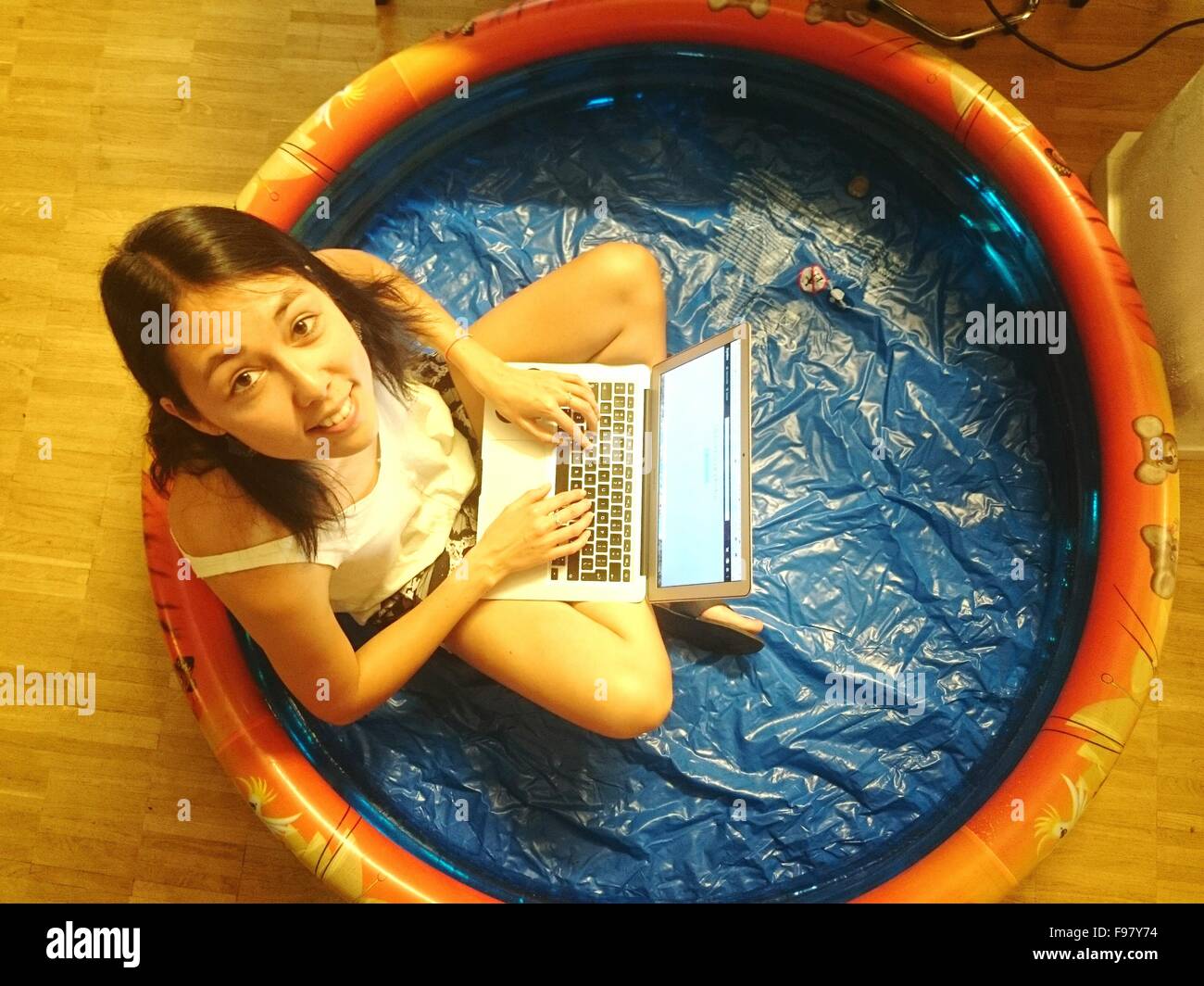 Laptop by the pool hi-res stock photography and images - Alamy