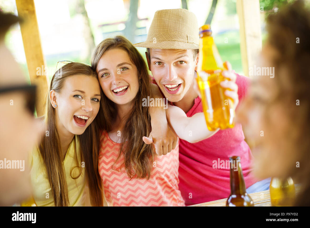 Group of happy friends drinking and having fun in pub garden Stock ...
