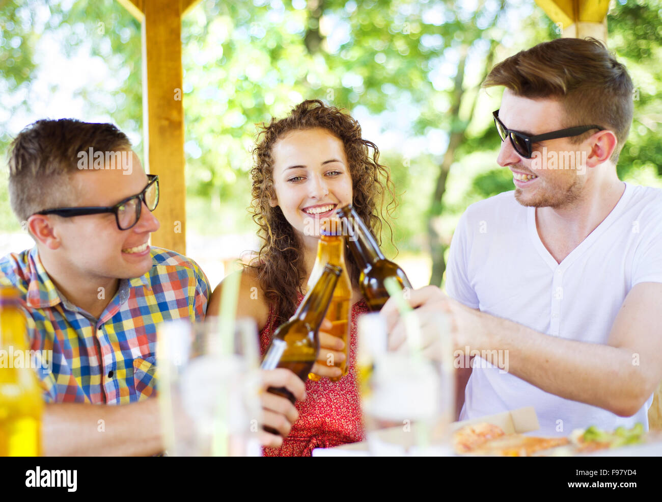 Group of happy friends drinking and having fun in pub garden Stock ...