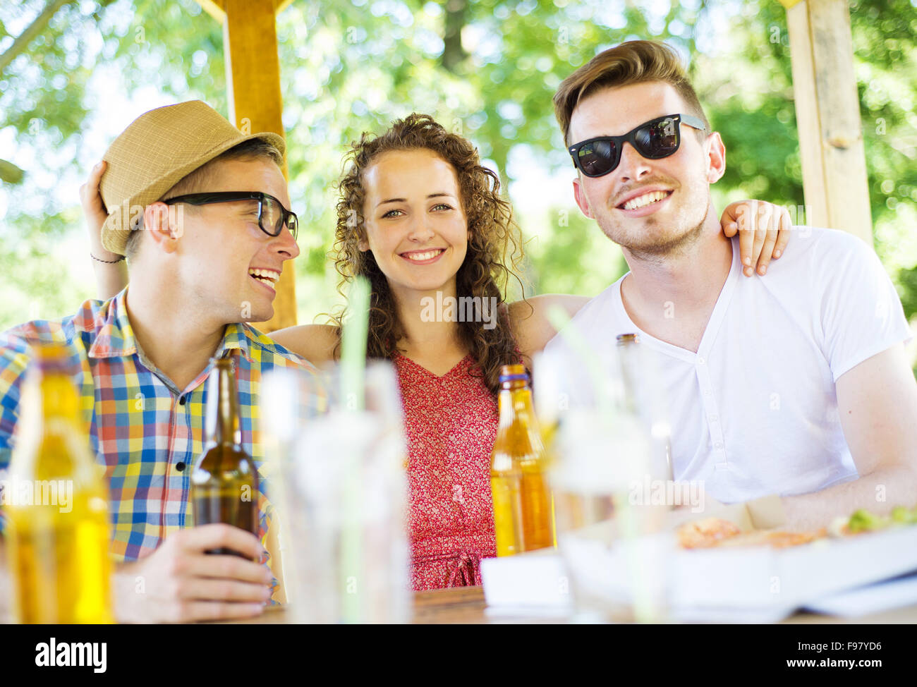 Group of happy friends drinking and having fun in pub garden Stock ...