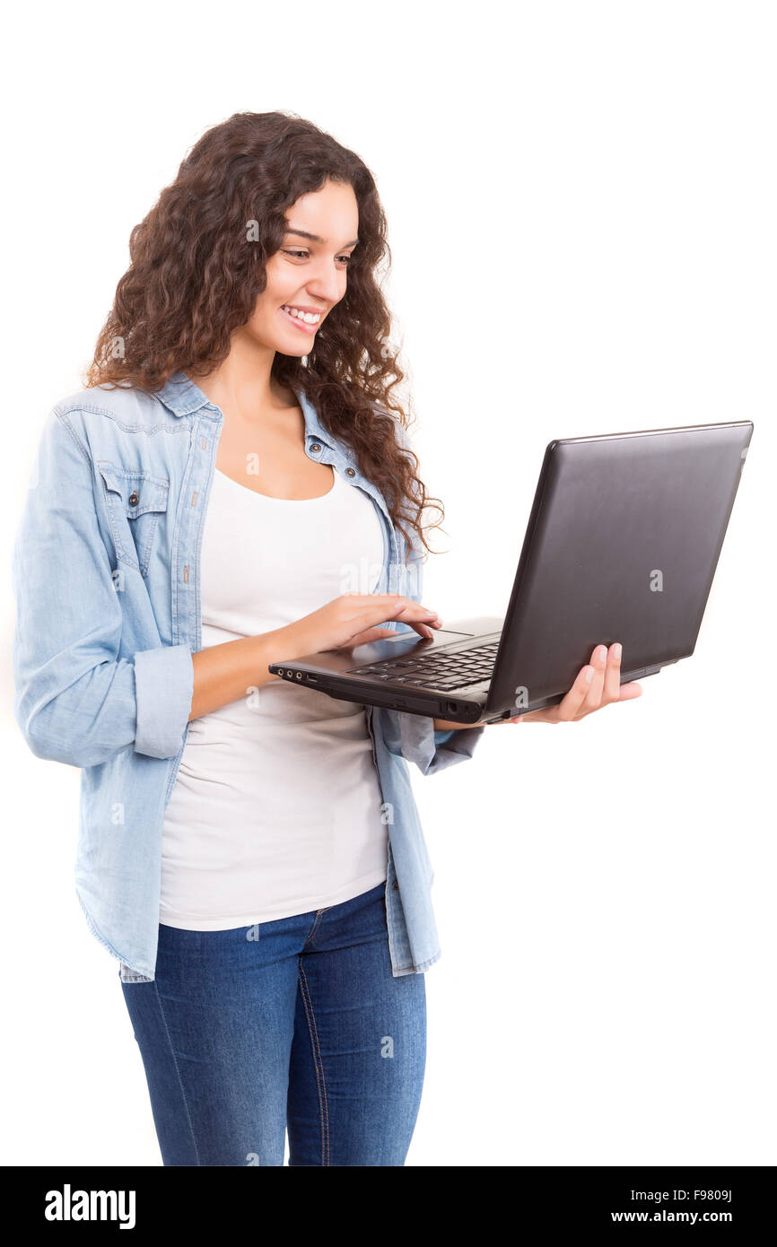 Young student working with her laptop, isolated over a white background ...