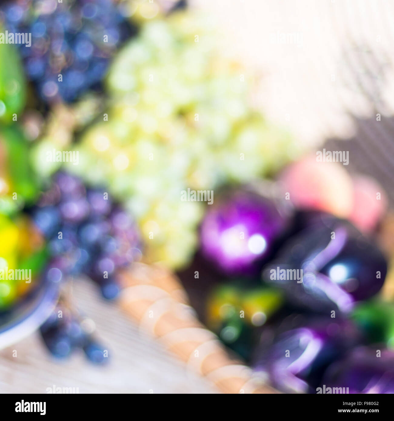 fruits and vegetables blur background. Eggplant grapes and various ...