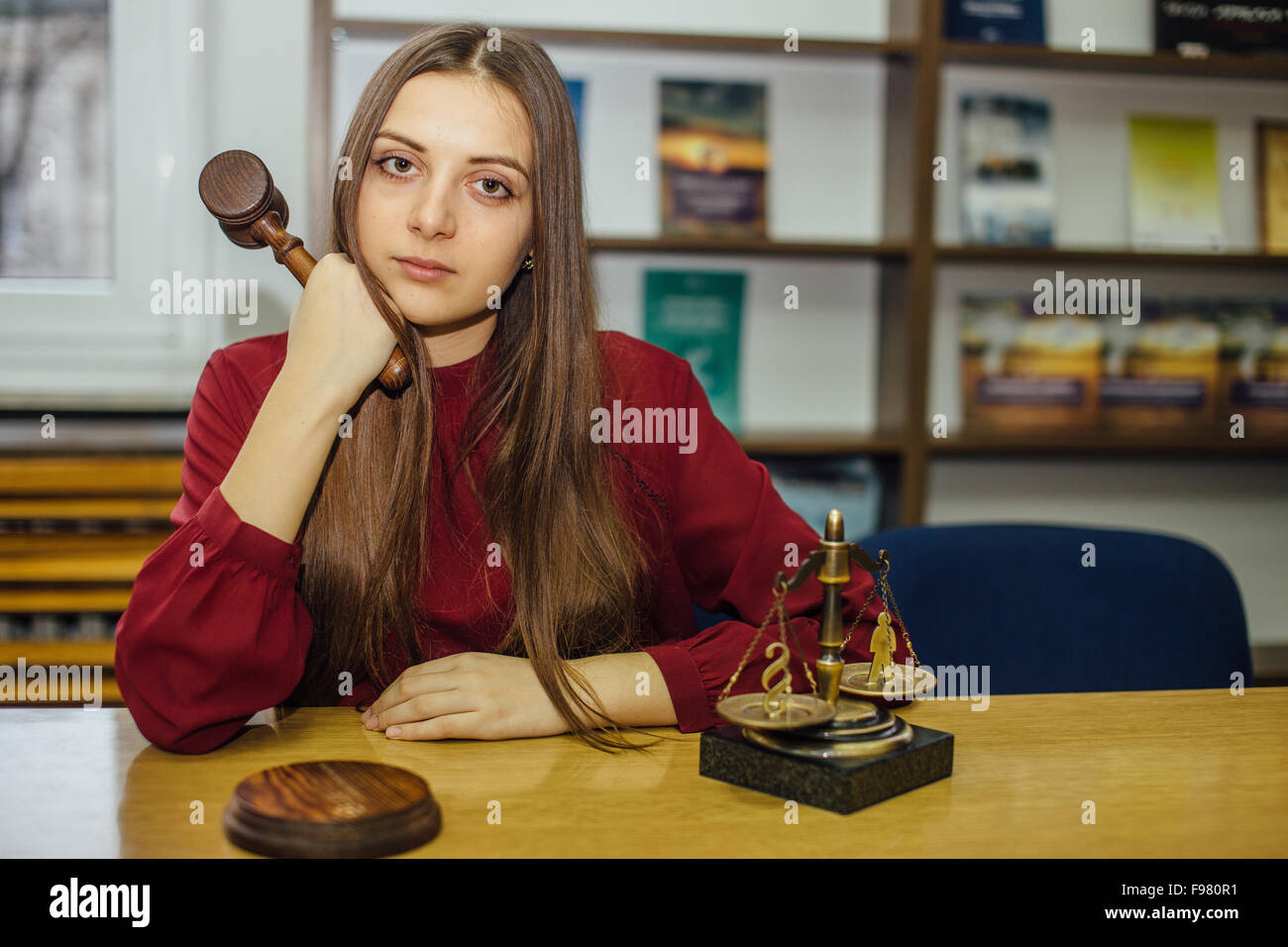 Judge in a courtroom striking the gavel and smile Stock Photo - Alamy