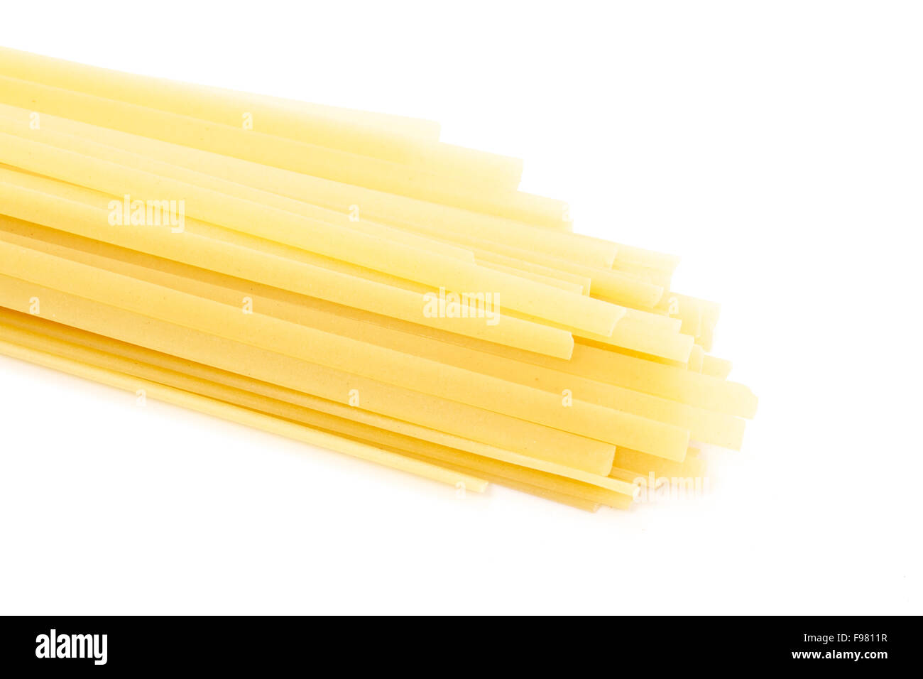 Dry spaghetti isolated on white Stock Photo - Alamy