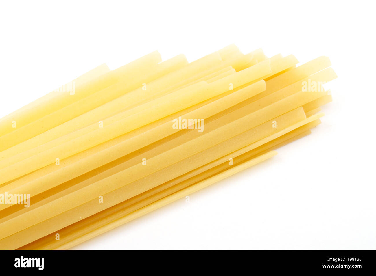 Dry spaghetti isolated on white Stock Photo - Alamy