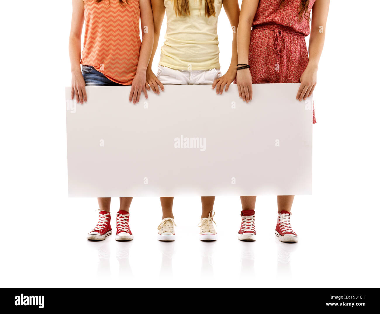 Group of happy young teenager students standing and smiling with blank ...