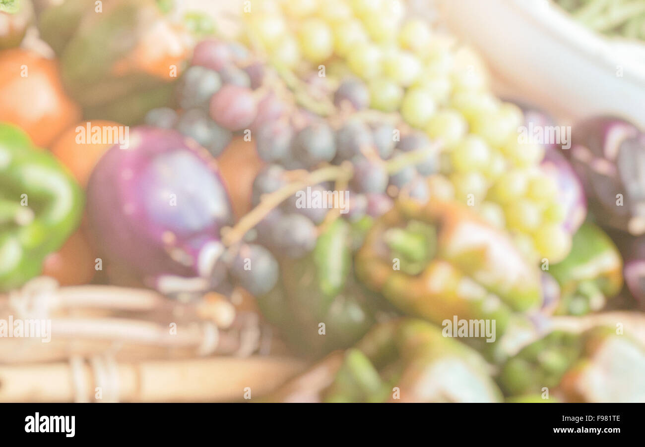 fruits and vegetables blur background. Eggplant grapes and various ...