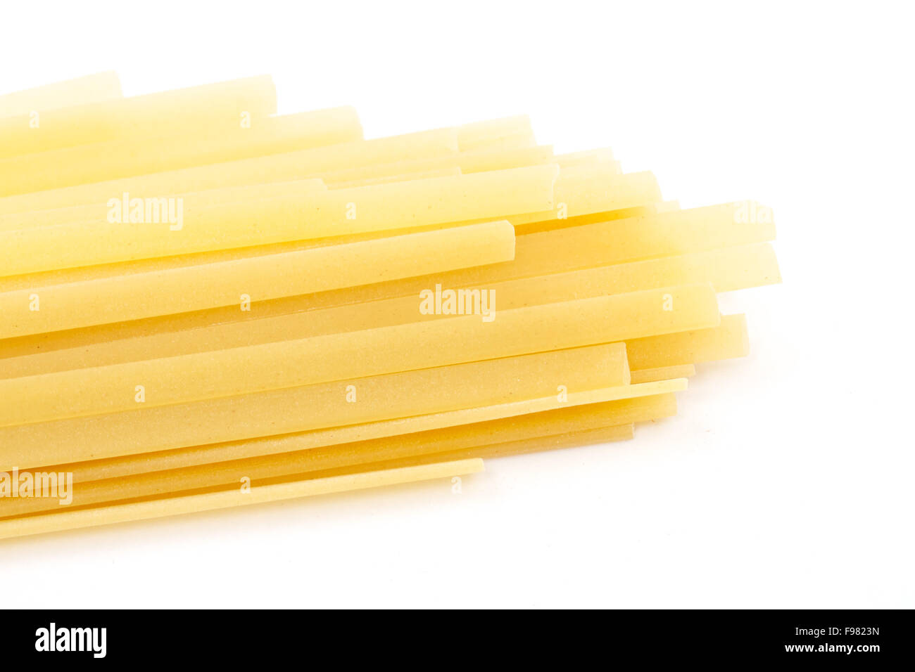Dry spaghetti isolated on white Stock Photo - Alamy