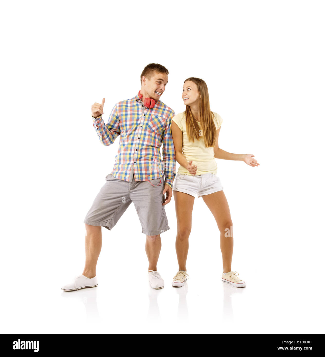 Smiling young people dancing, isolated on white background Stock Photo ...