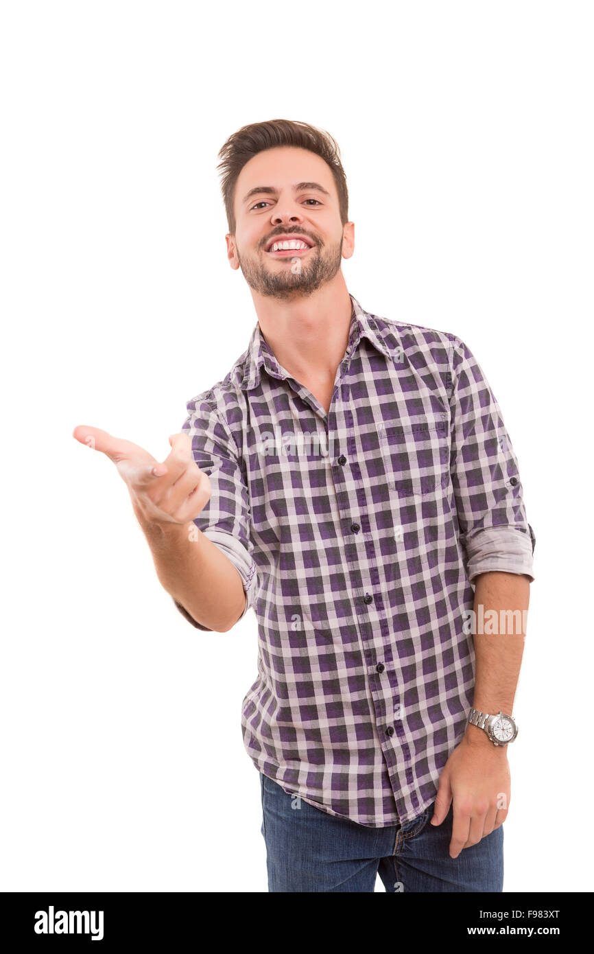 Handsome young man pointing at you, isolated over white background ...