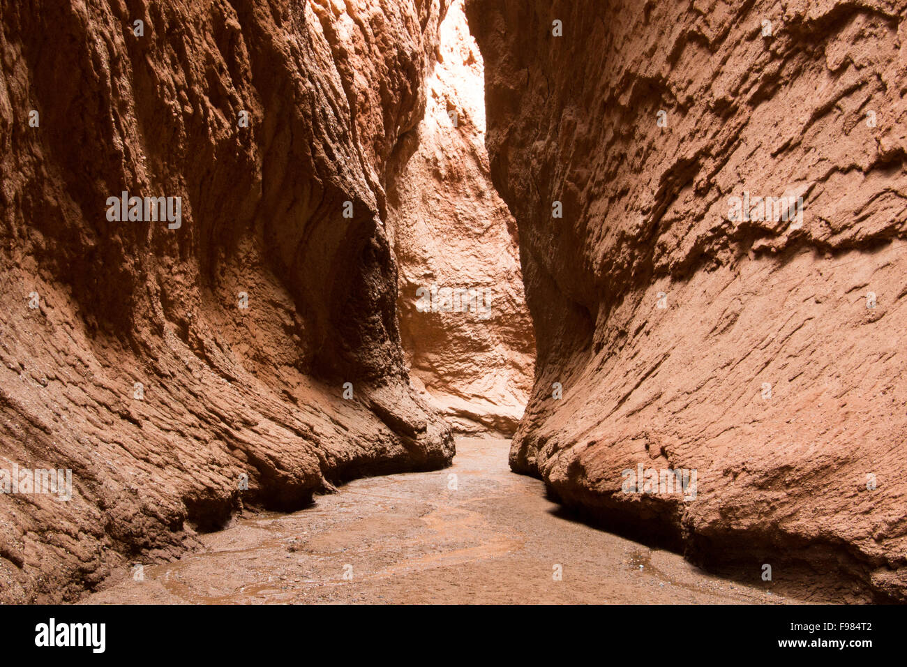 Narrow way out of the red hill canyon in Xinjiang China Stock Photo - Alamy
