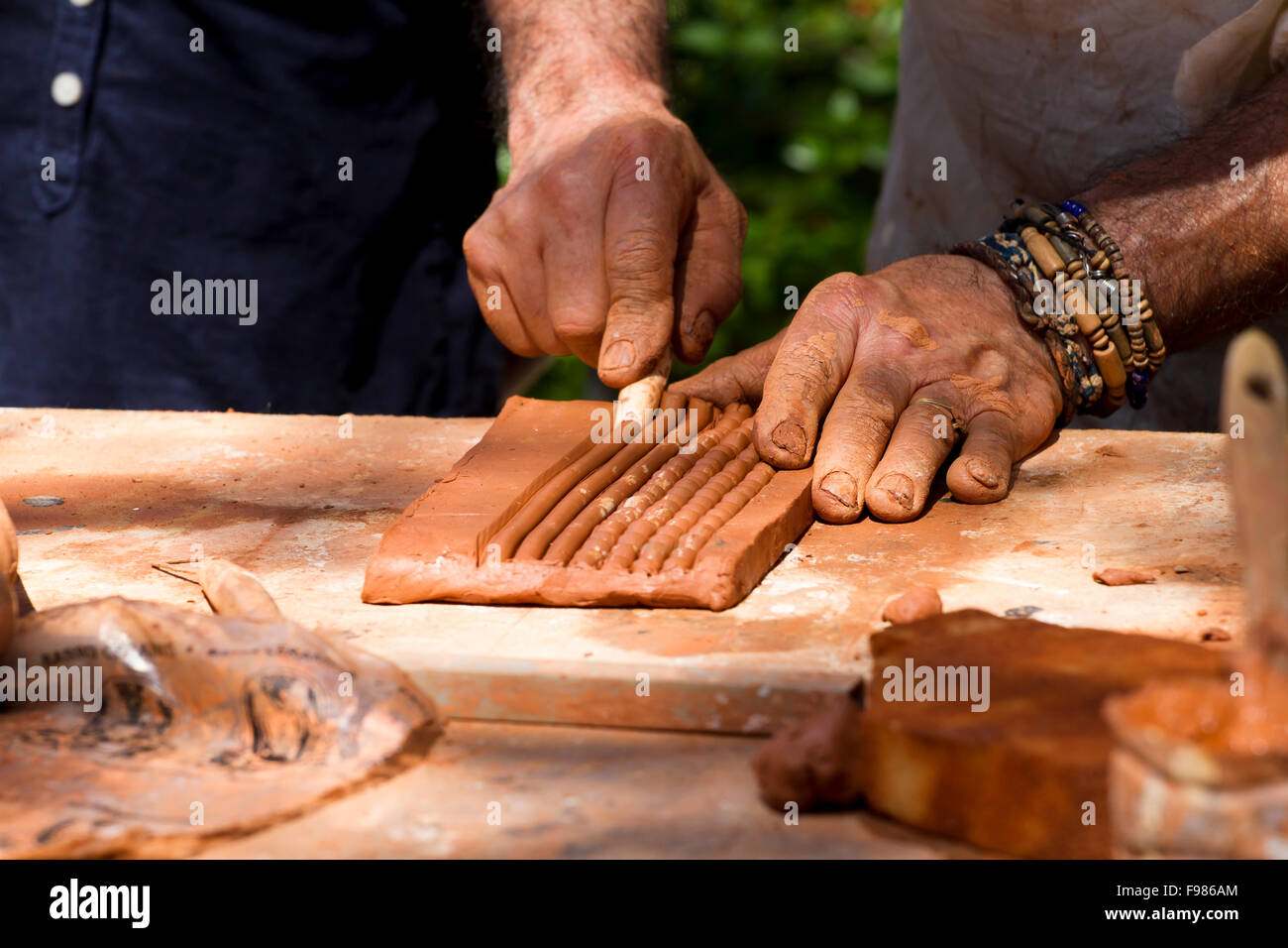 Men at work, clay craftsman Stock Photo - Alamy
