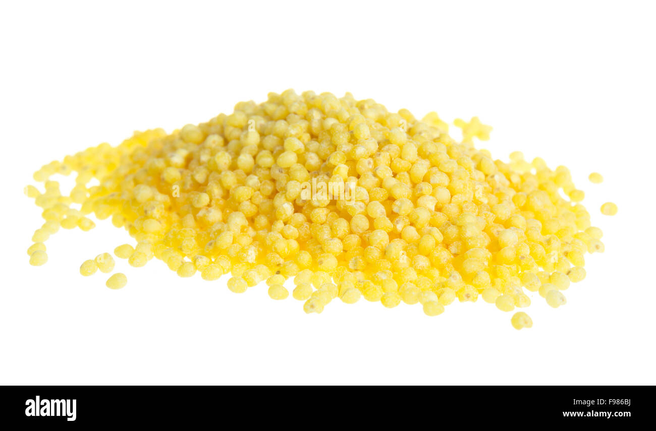 scoop of hulled millet Stock Photo - Alamy