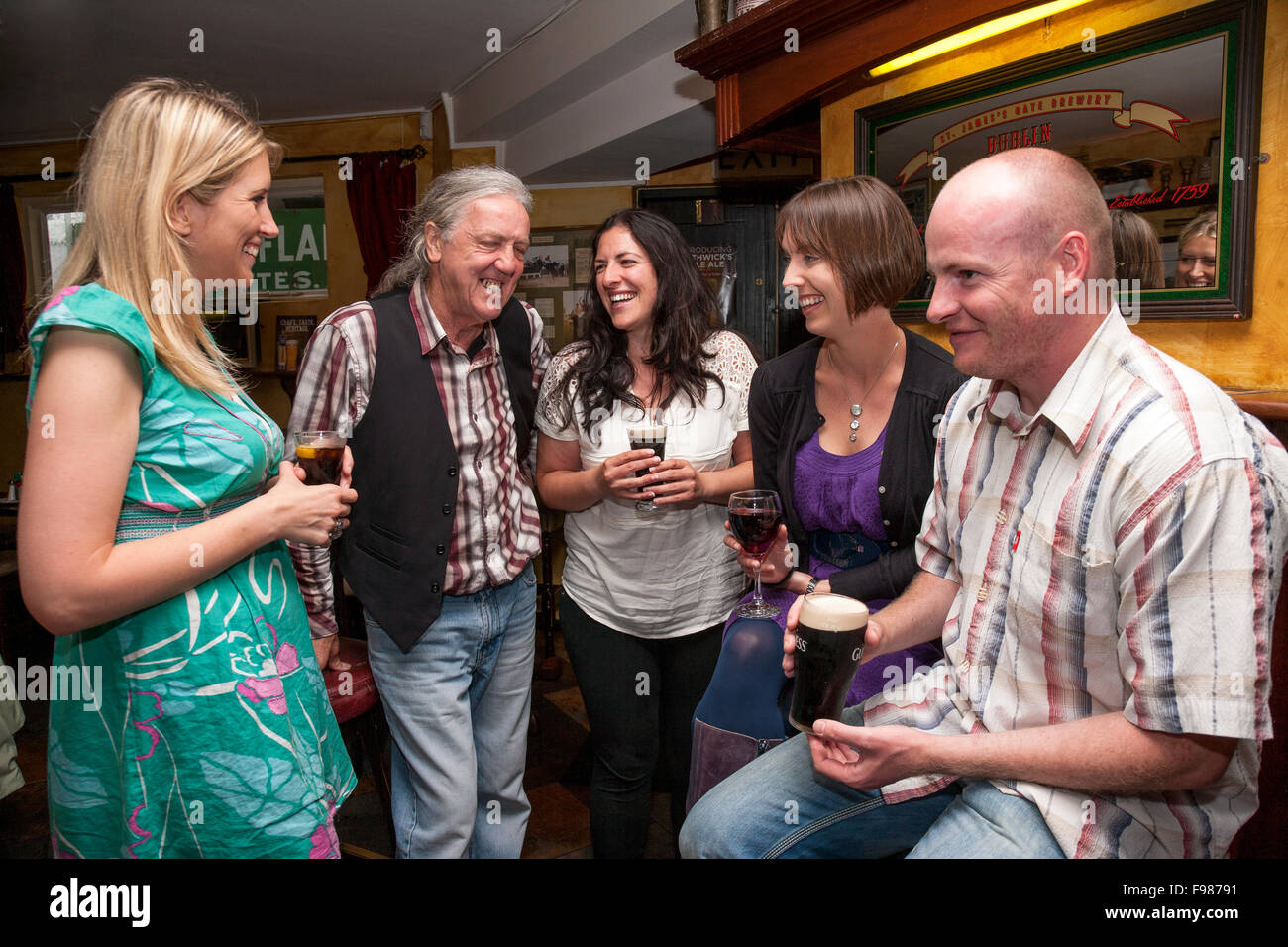 Irish pub, bar. People of mixed ages socializing. Adare County Limerick ...