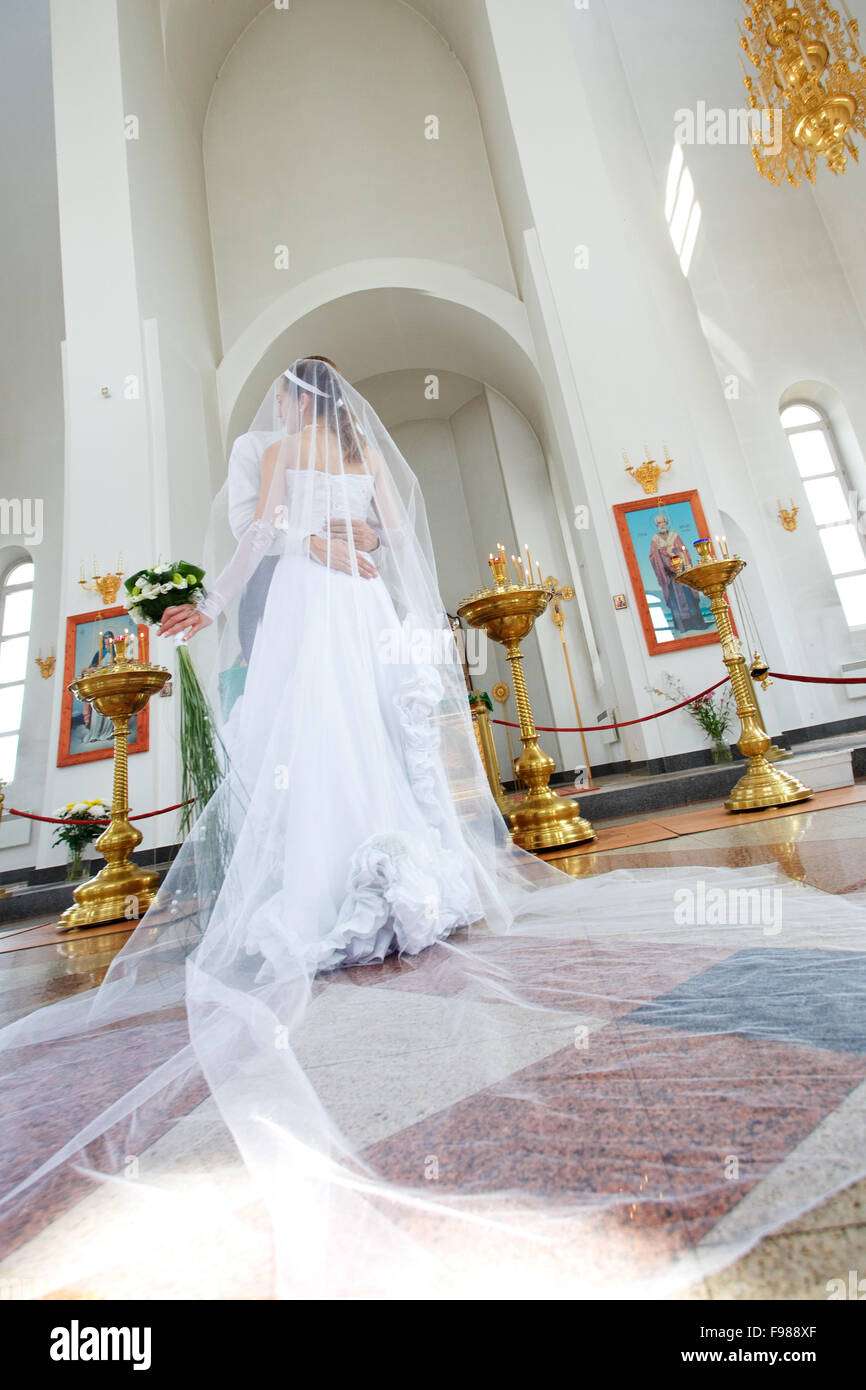 bride and groom in the church Stock Photo - Alamy
