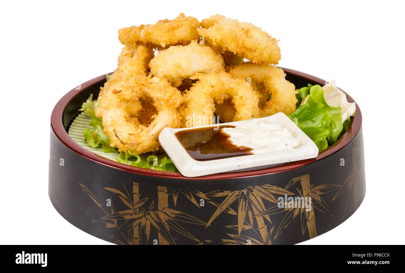 Deep batter fried squid rings calamari with green salad Stock Photo - Alamy