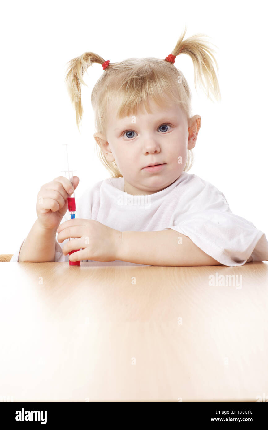 child playing with a syringe Stock Photo - Alamy