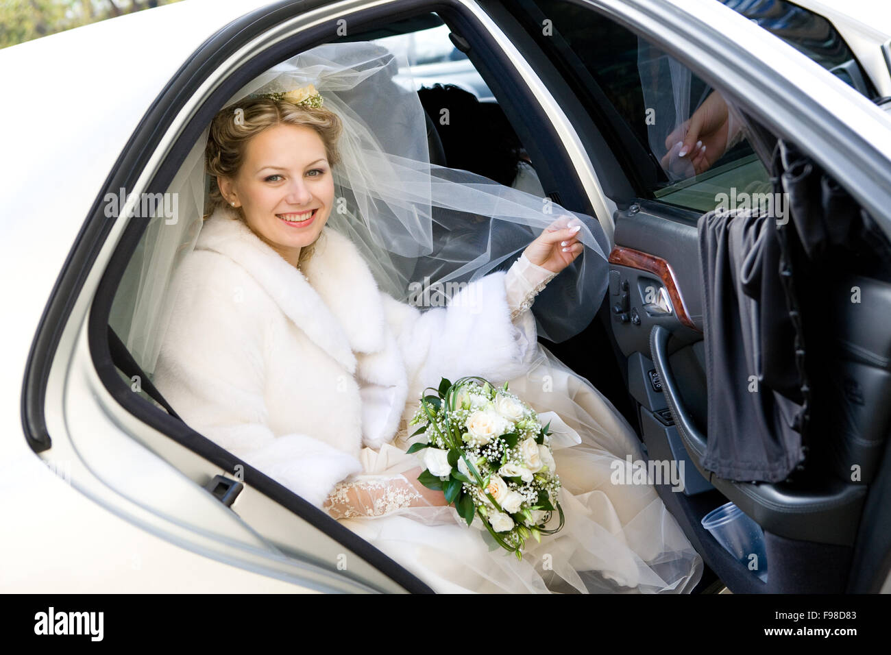 portrait of the bride in the wedding car Stock Photo - Alamy