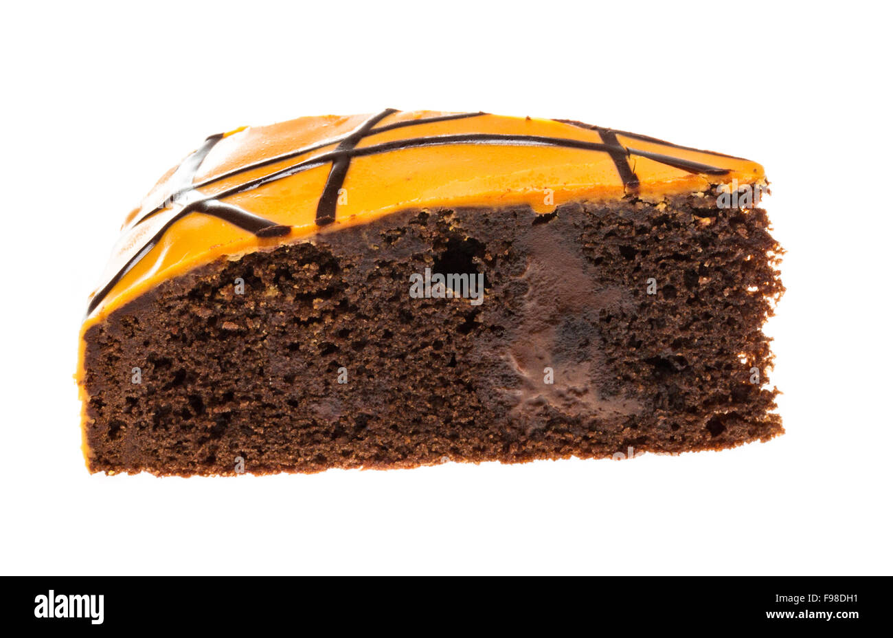 Piece of chocolate cake with icing on white isolated background Stock ...