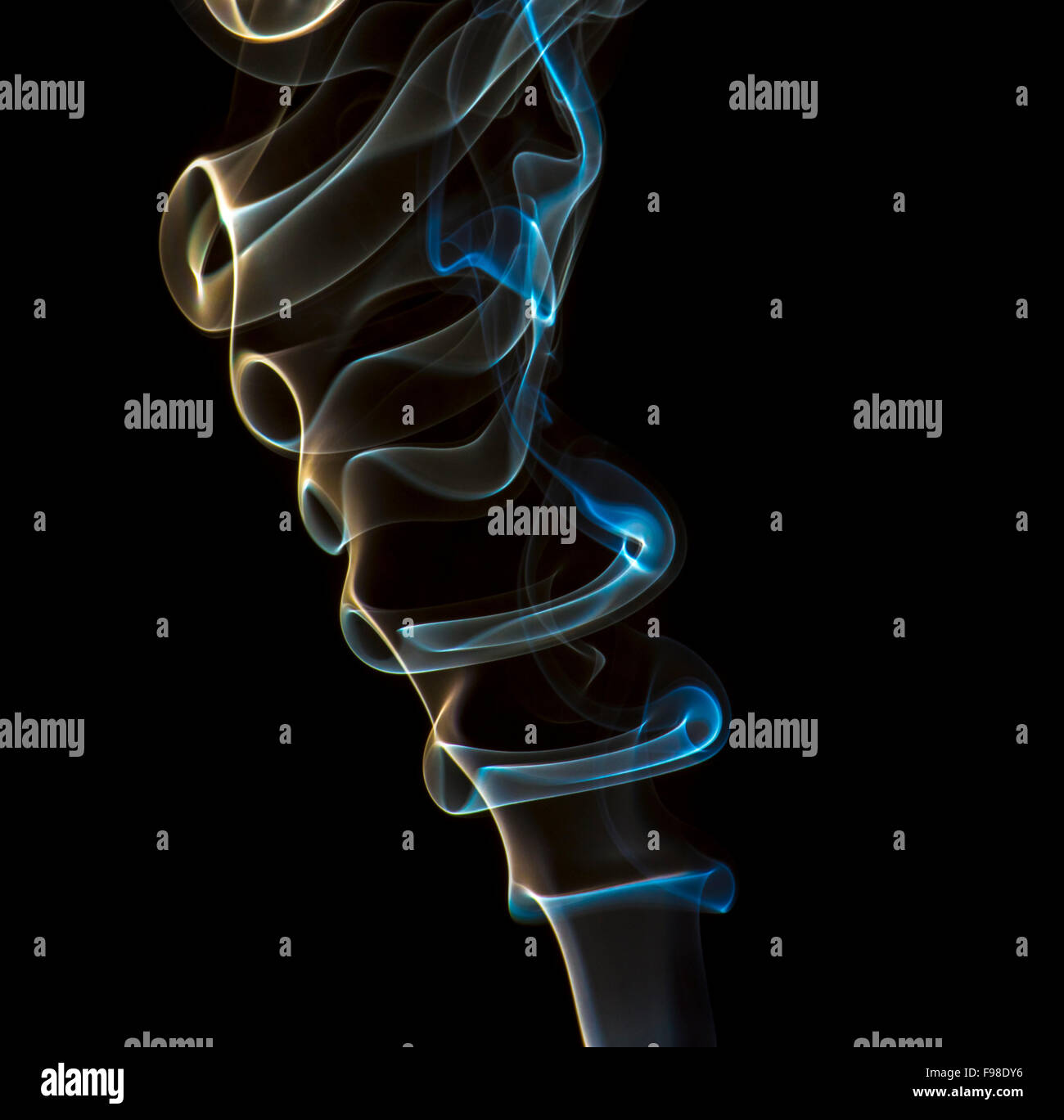 Fume of a incense stick, black background Stock Photo - Alamy