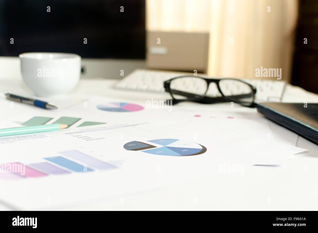 Financial paper charts and graphs on the table Stock Photo - Alamy