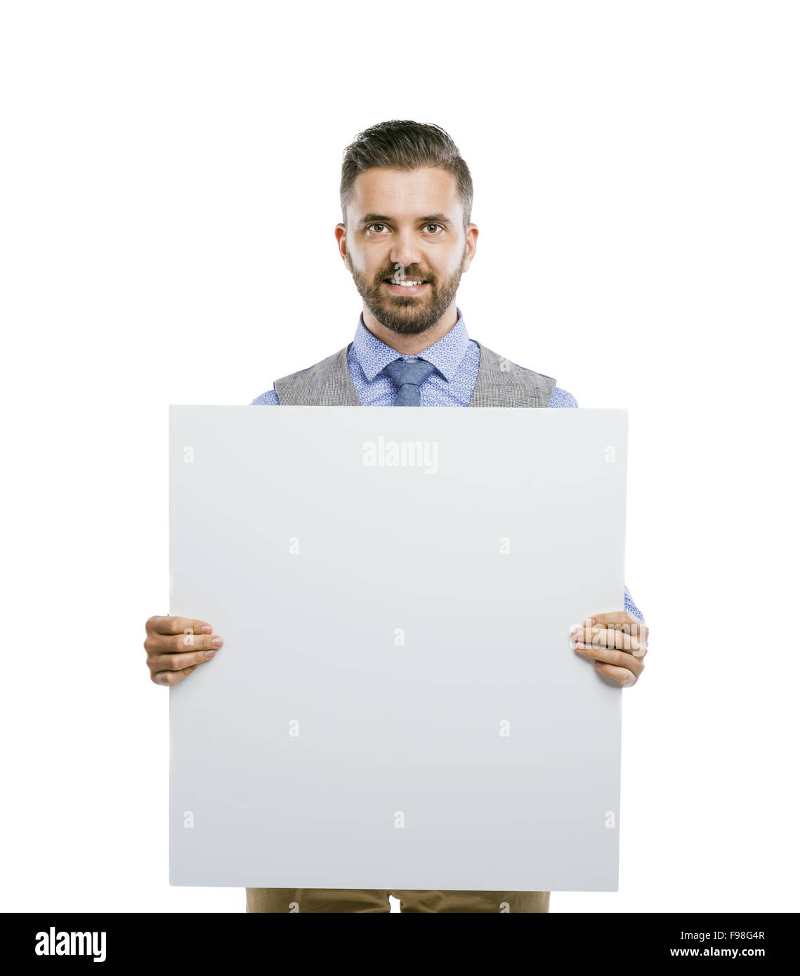 Studio shot of modern hipster businessman holding blank advertisement ...