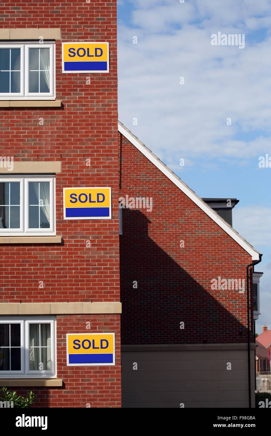 New Houses for Sale with sold signs Stock Photo - Alamy