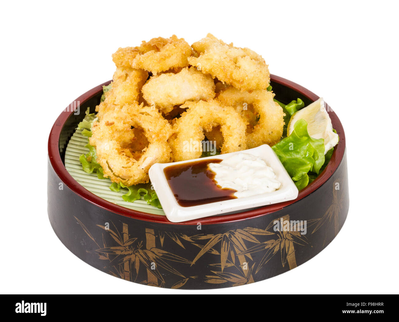 Deep batter fried squid rings calamari with green salad Stock Photo - Alamy
