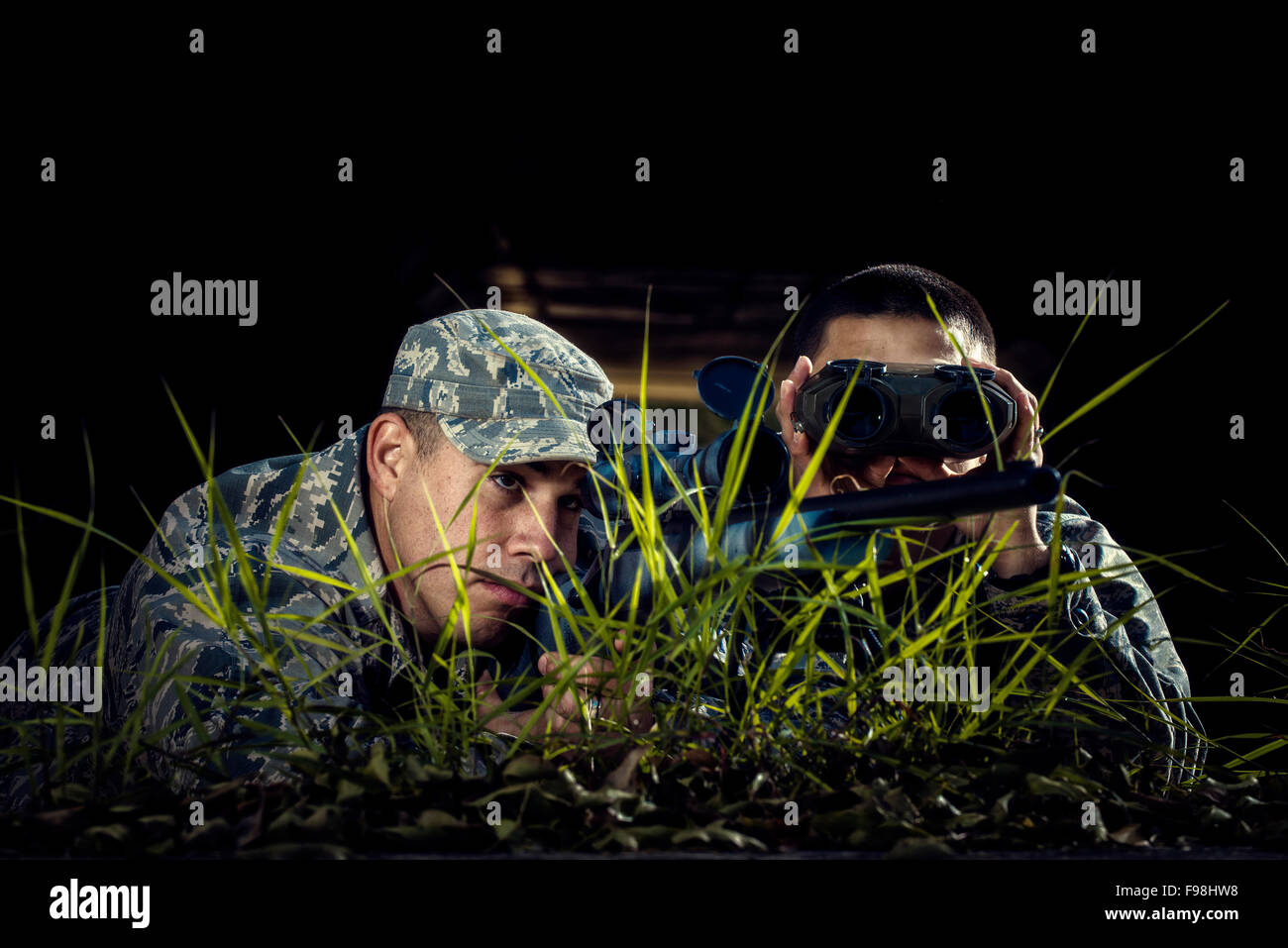 An advanced Air Force Security Forces sniper team observe potential targets during training ...
